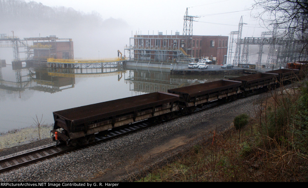 665 - Side dump cars bring up rear of eastbound mty ballast train.